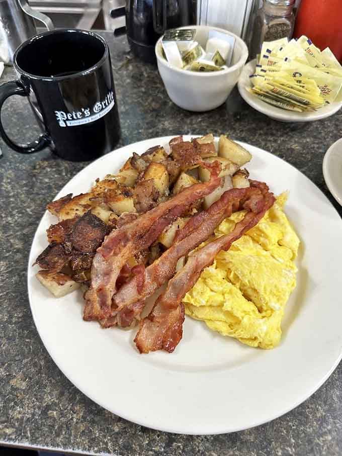 Bacon strips standing at attention like delicious soldiers, eggs cooked exactly how you dreamed they'd be.