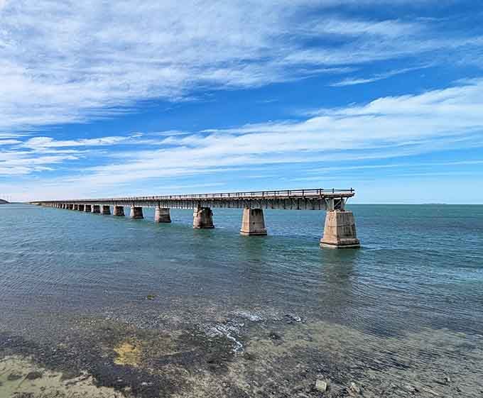 The historic bridge pillars stand as silent witnesses to over a century of Keys history and determination.