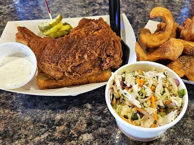 When fried chicken meets tangy slaw and crispy onion rings, it's like the Beatles getting back together but tastier.