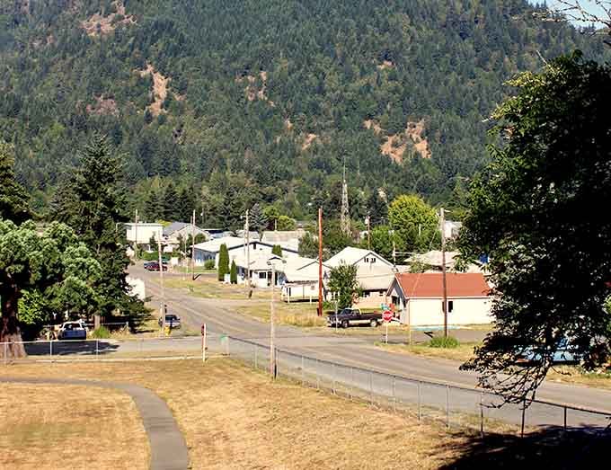 Tree-covered mountains embrace this tiny community like nature's own protective hug, keeping the modern world at bay.