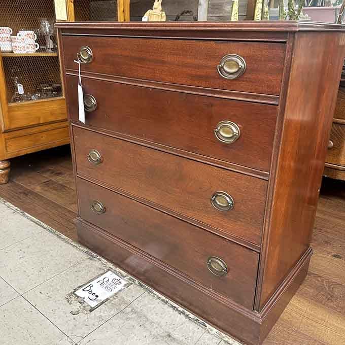 Solid mahogany chest with brass hardware, built when furniture makers actually cared about things lasting beyond next Tuesday.