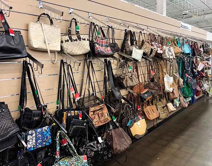 A wall of purses waiting for their next adventure; somewhere here hangs your new favorite everyday companion.