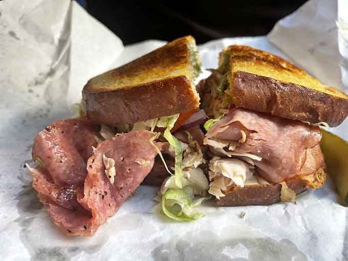That cross-section reveals the beautiful chaos inside, where every ingredient fights for attention like siblings at dinner.