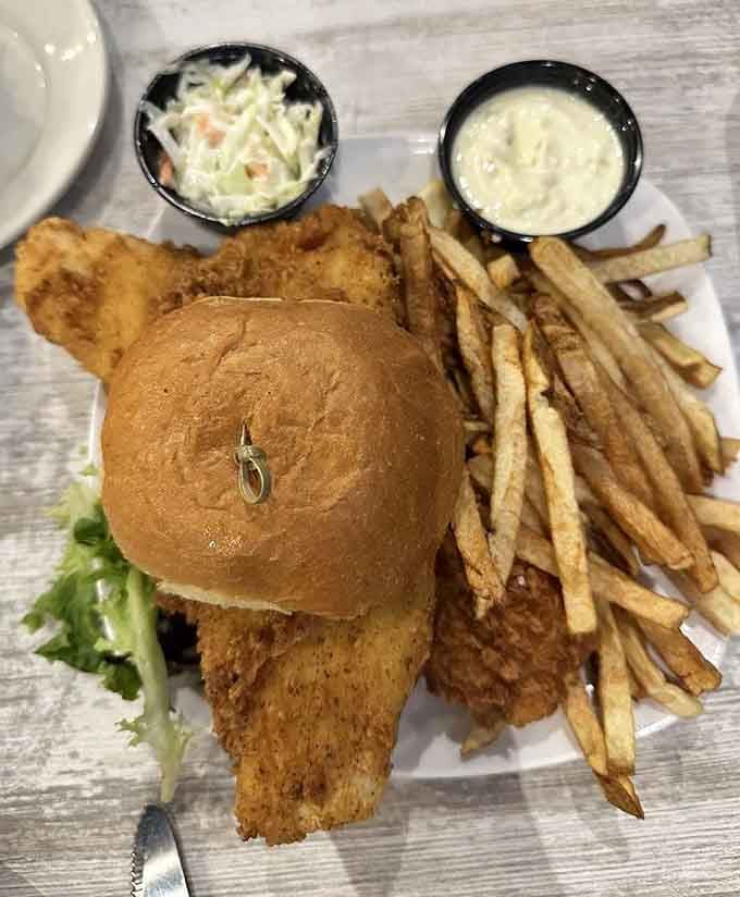 This fish sandwich towers like a delicious skyscraper, proving bigger is definitely better when battered and fried.