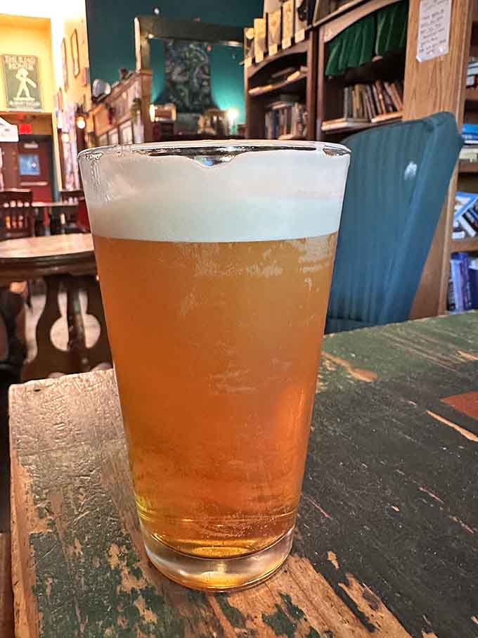 That golden glow of a perfectly poured IPA surrounded by thousands of potential adventures in book form.