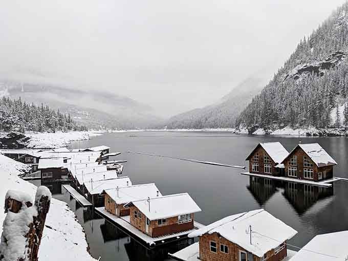 Winter transforms the floating cabins into a snow globe scene that's almost too perfect to believe.