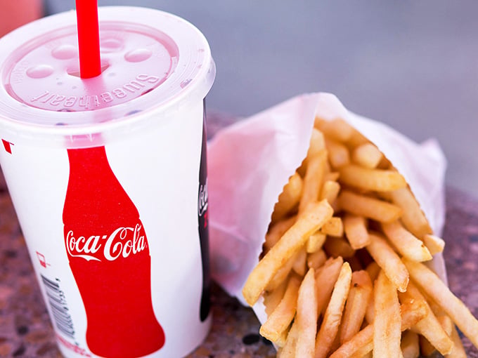 A cold drink and hot fries, the dynamic duo that's been fueling road trips since automobiles were invented.