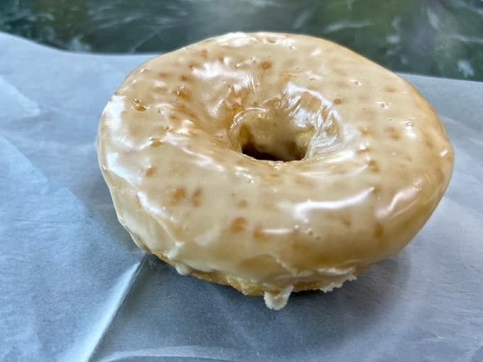 That glaze dripping down the sides is basically liquid gold in donut form, and nobody can convince us otherwise.