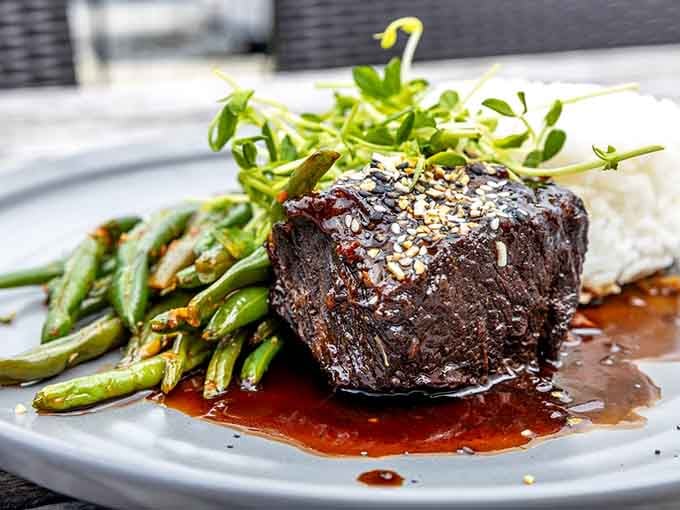 Korean short ribs glazed to perfection demonstrate that great cooking transcends borders and exceeds expectations every time.