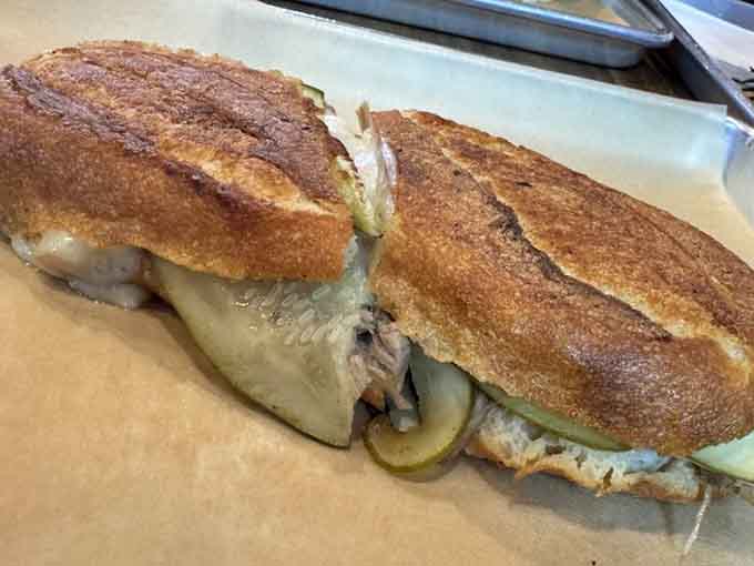 The French Cuban at Sandwichitos proves international diplomacy works best when cheese sauce is involved in negotiations.
