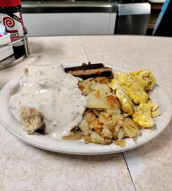Biscuits drowning in sausage gravy, the kind of breakfast that makes you understand why people write love songs about food.
