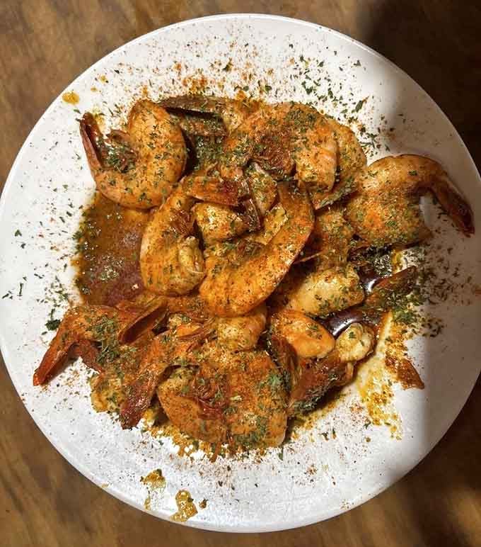 Shrimp swimming in garlic butter and herbs, because subtlety is overrated when flavors are this magnificently bold.