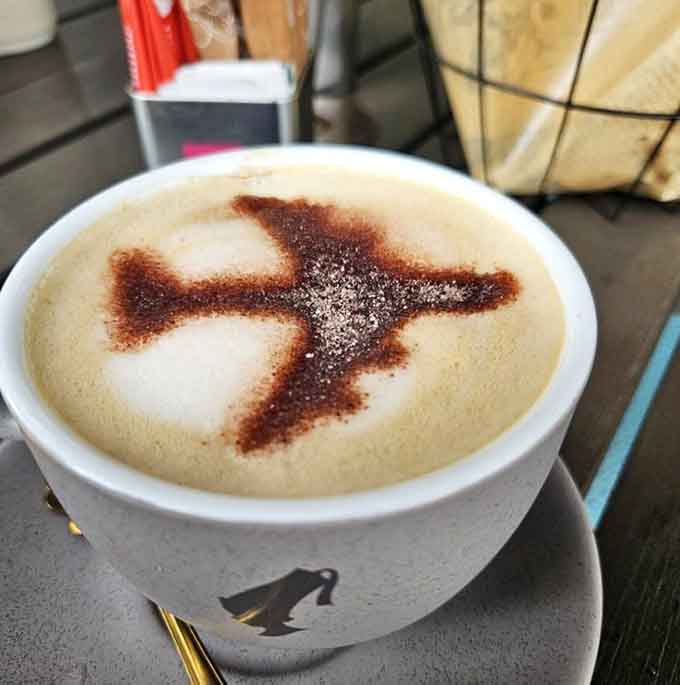 That airplane stencil in the foam is almost too pretty to drink, but caffeine needs trump Instagram aesthetics.