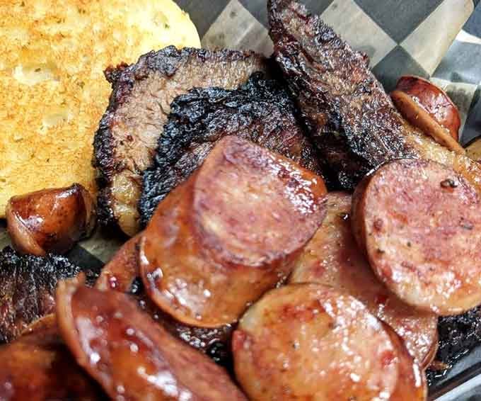 Brisket and smoked sausage glistening with that perfect bark&mdash;this is what pitmasters dream about at night.