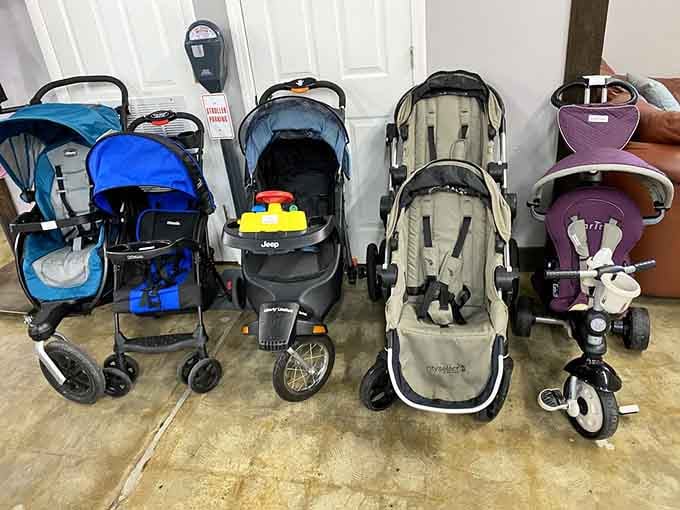 This stroller lineup looks like a parking lot for tiny humans, each one ready for its next adventure.