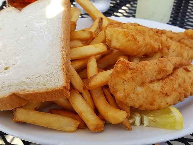 Crispy, golden fried fish with a lemon wedge and a mountain of fries. Wisconsin fish done exactly right.