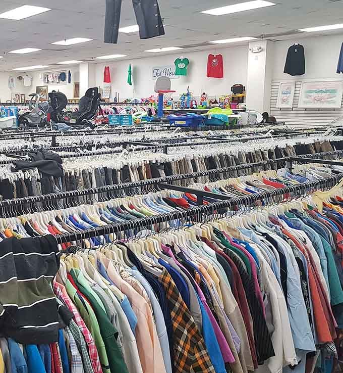 Rows of men's shirts stretch toward infinity, proving style doesn't require draining your retirement account first.