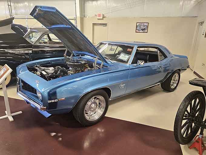 Hood up on this sky-blue classic reveals the mechanical heart that made the muscle car era legendary.