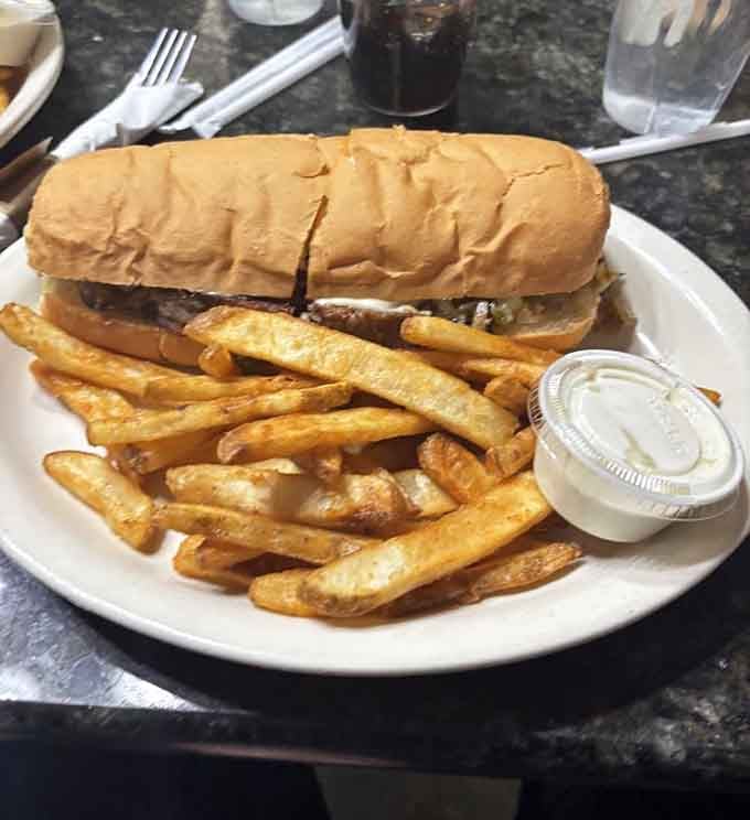 A Philly cheesesteak with golden fries proves this cafe masters more than just traditional pasties.