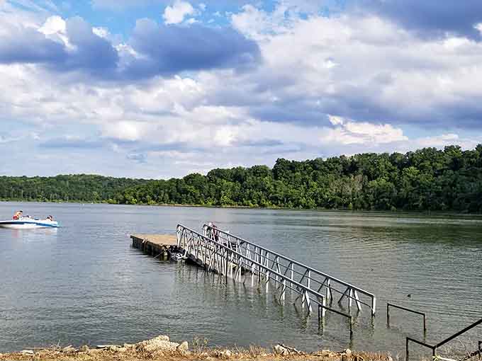 Where tranquil waters meet wooded shorelines, this peaceful dock extends an invitation to slow down and breathe.