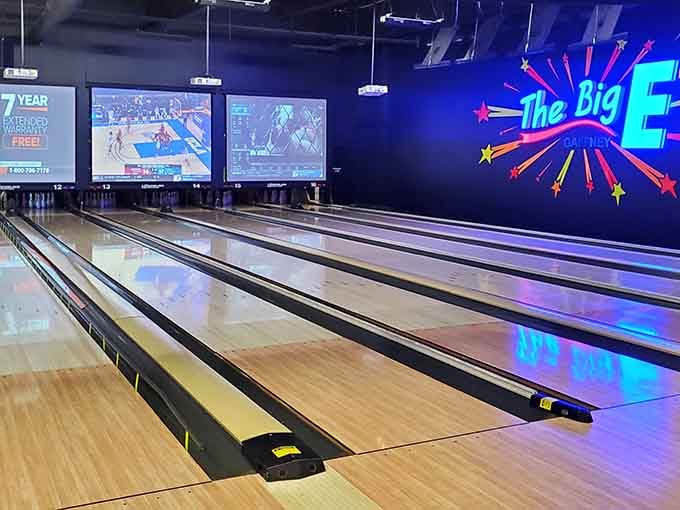 Bowling lanes gleam under The Big E's signature lighting, ready for strikes, spares, and gutter balls alike.