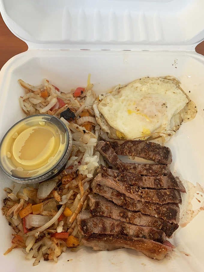 Perfectly seared steak with eggs and crispy home fries, proving breakfast can be both hearty and surprisingly elegant.