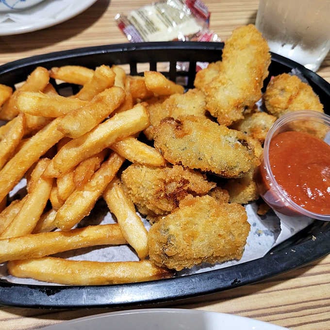 Golden-fried oysters paired with fries, because sometimes the ocean needs a little landlocked companionship on the plate.