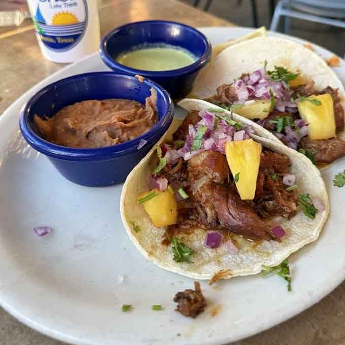 Smoked pork tacos topped with fresh pineapple chunks, proof that the best ideas sound a little unexpected at first.