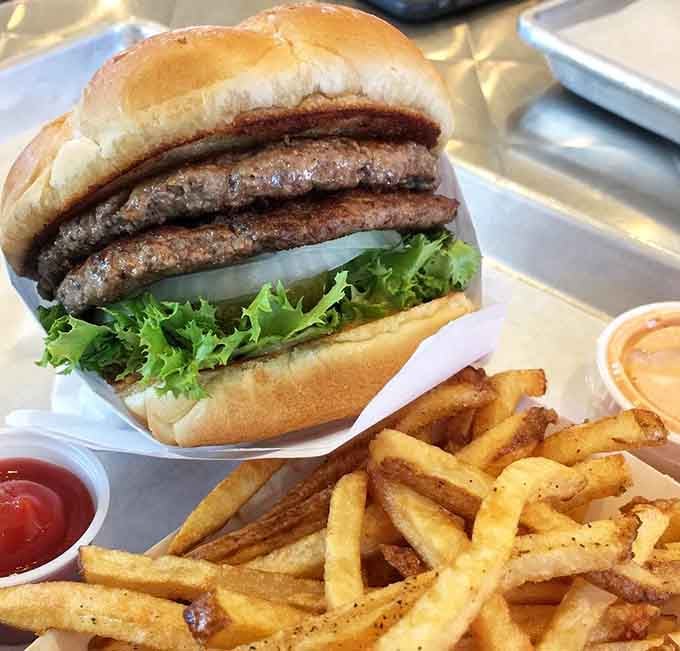 Two juicy patties stacked high with fresh veggies, this Standard burger absolutely lives up to its confident name.