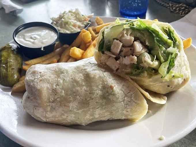 Fresh grilled chicken caesar wrap comes loaded with crisp lettuce, a portable lunch that actually tastes like real food.