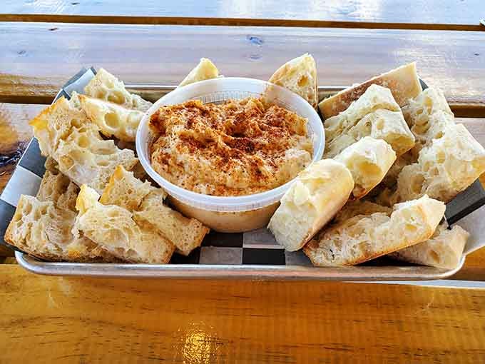 Fresh bread and creamy crab dip by the water, because some combinations are just meant to be together.