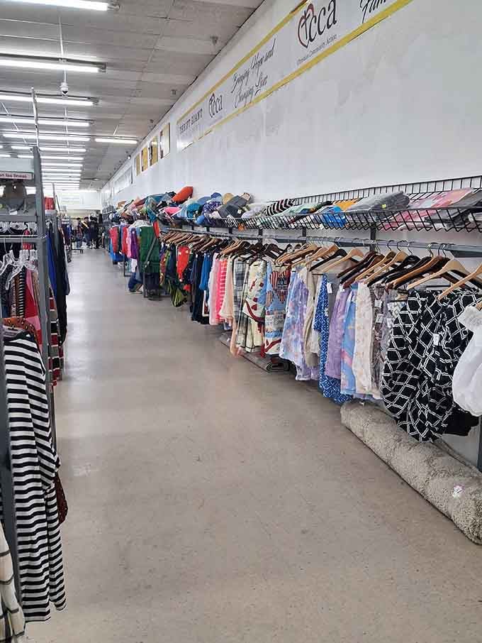 Colorful patterns cascade down the racks like a fabric waterfall, each piece softer than your favorite memories.