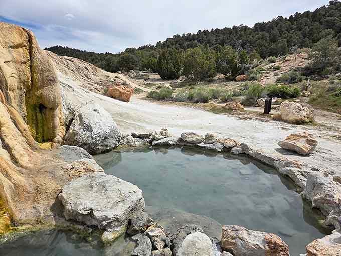 Tucked beneath juniper-covered hills, this quiet pool feels like a secret the landscape is keeping for you.