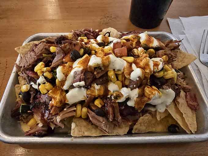 Loaded nachos topped with barbecue might be the greatest fusion cuisine nobody asked for but everyone needed.