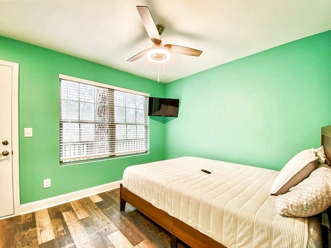 Sleeping quarters painted in a shade of green that somehow makes you feel more connected to nature.