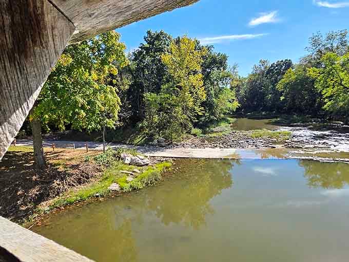 The creek below flows peacefully, completely unaware it's been doing this job for over 150 years without a raise.
