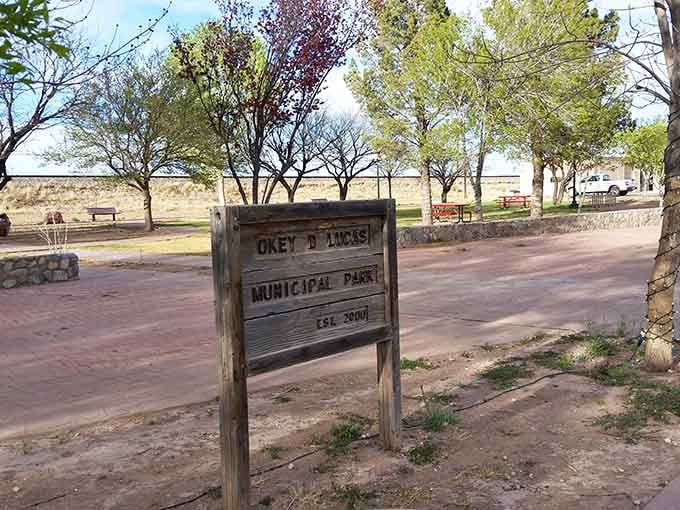 Okey D Lucas Municipal Park offers shaded respite where locals gather and travelers stretch their weary legs.