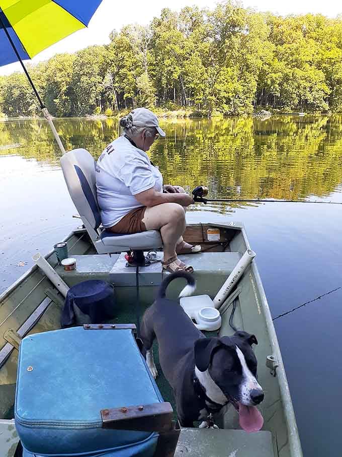 This gentleman and his fishing buddy have their priorities straight: peaceful water, good company, perfect day.