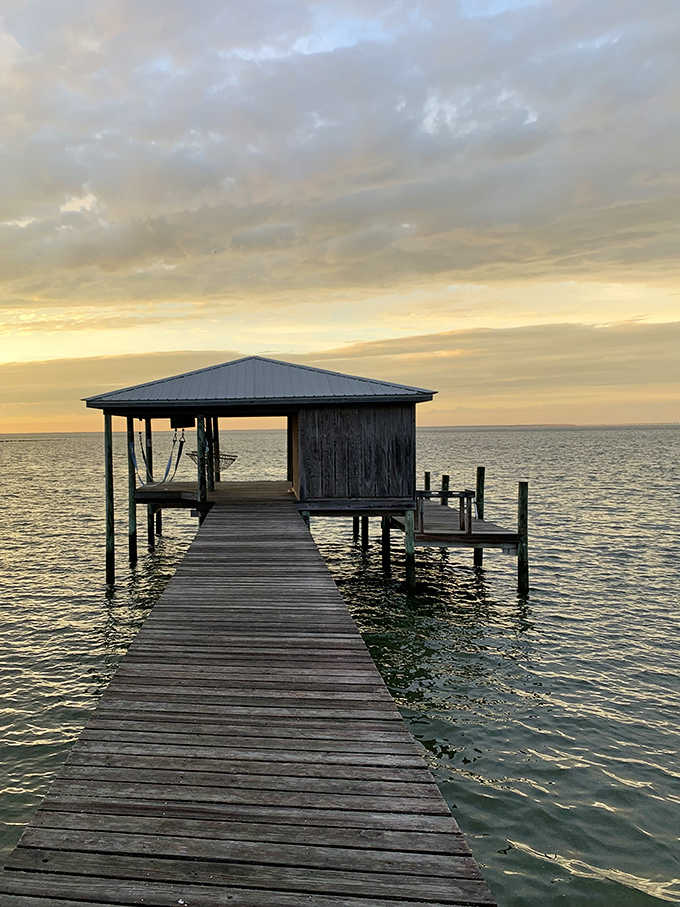 Old wooden piers tell stories the modern world forgot, standing silent against endless water.