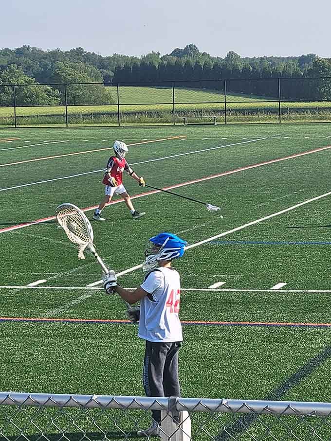 Young lacrosse players learning the ancient art of catching things with sticks, a skill surprisingly useful in life.