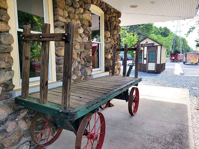 Even the baggage cart looks ready for duty, a wooden reminder of when luggage handling was pure muscle power.