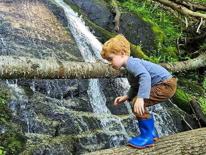 Blue boots, big waterfall, bigger memories being made one careful step at a time.