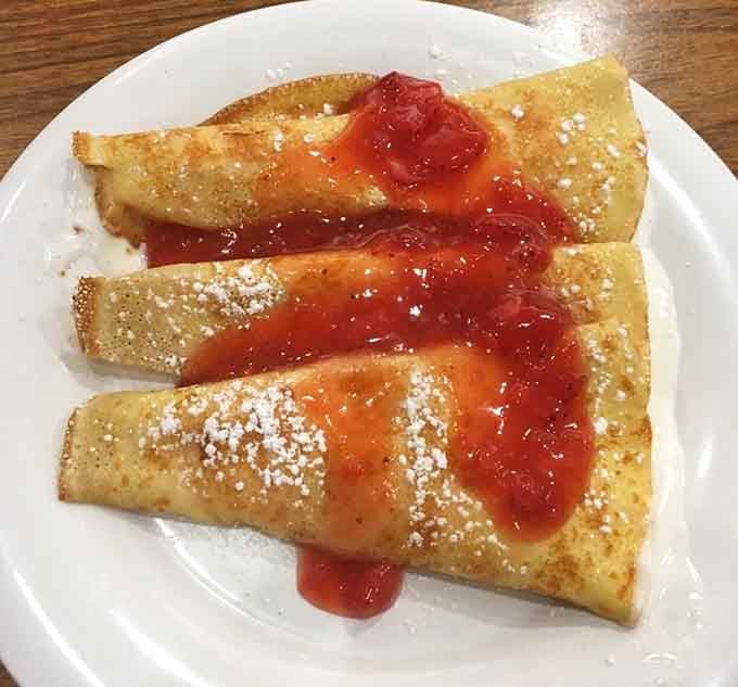 Strawberry crepes dusted with powdered sugar prove that breakfast can be both elegant and utterly satisfying at once.