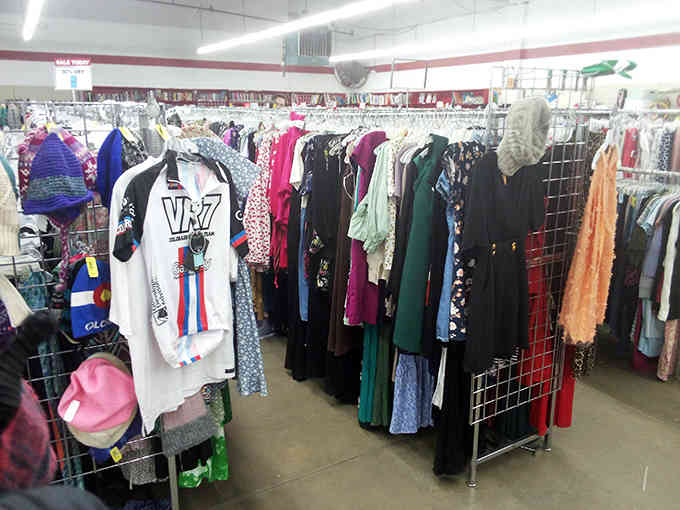 Clothing racks burst with color and pattern, offering fashion possibilities that department stores charge triple digits to provide.
