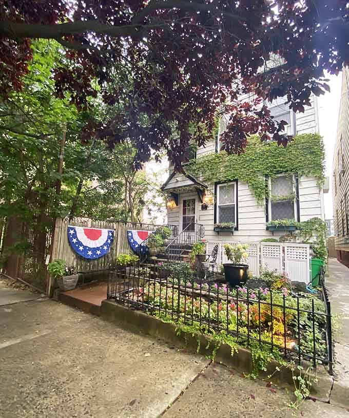 The patriotic bunting and lush garden make this charming house feel like dining at your favorite neighbor's place.