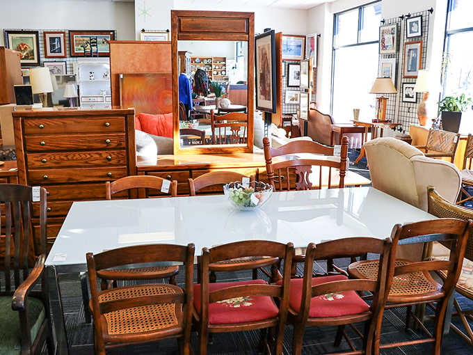 Solid wood dressers, cane-back chairs, and a gleaming white dining table make this furniture section look like a proper showroom.