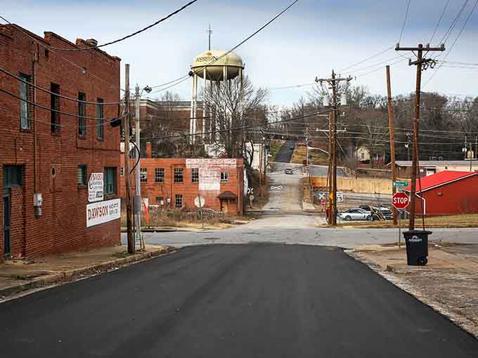 That distinctive water tower rises in the distance, a quirky landmark that says "you're home" to everyone who knows.