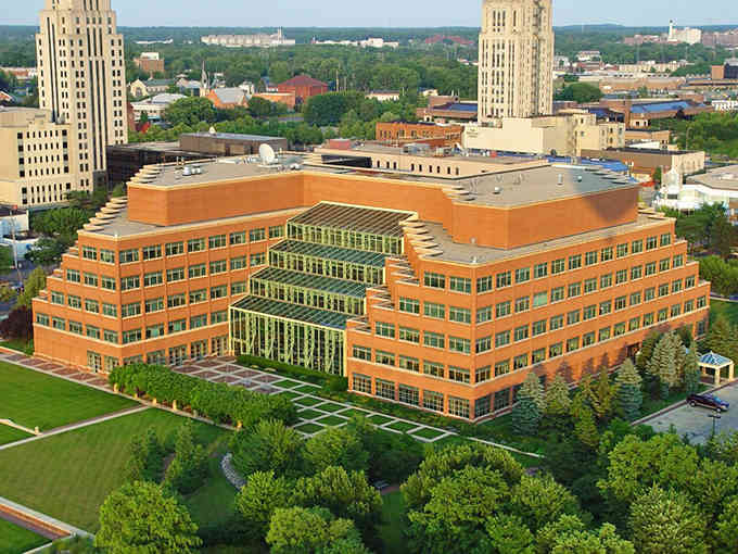 Modern architecture meets green space in this striking building that looks like a giant's perfectly wrapped present.