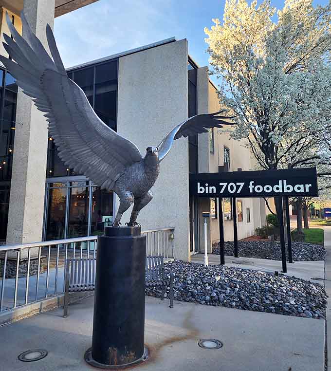 That magnificent eagle sculpture stands guard like a promise of soaring flavors and downtown dining adventures ahead.