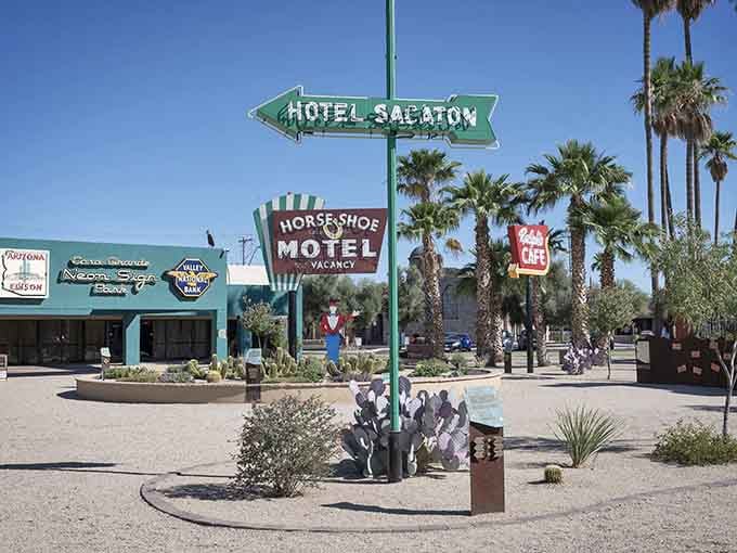 Vintage neon signs point toward budget-friendly lodging in a town where every dollar stretches like desert taffy.